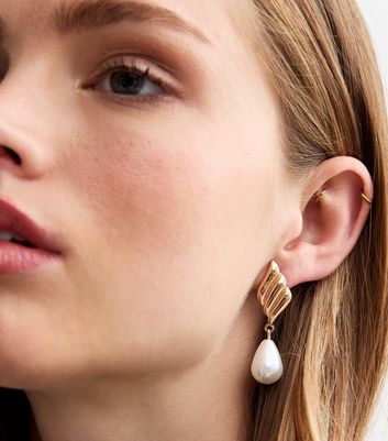 Imitation pearl earrings store